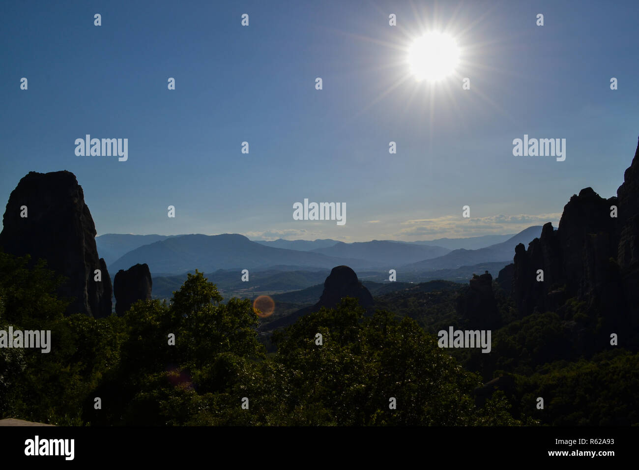 Sun over Meteora mountains in Greece Stock Photo - Alamy