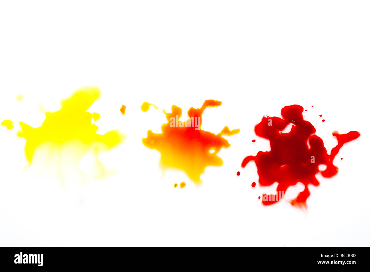 a spot of red paint on a white background. stain and spray Stock Photo ...