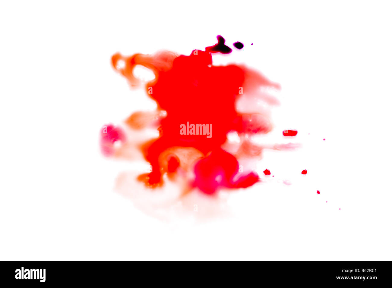 a spot of red paint on a white background. stain and spray Stock Photo ...