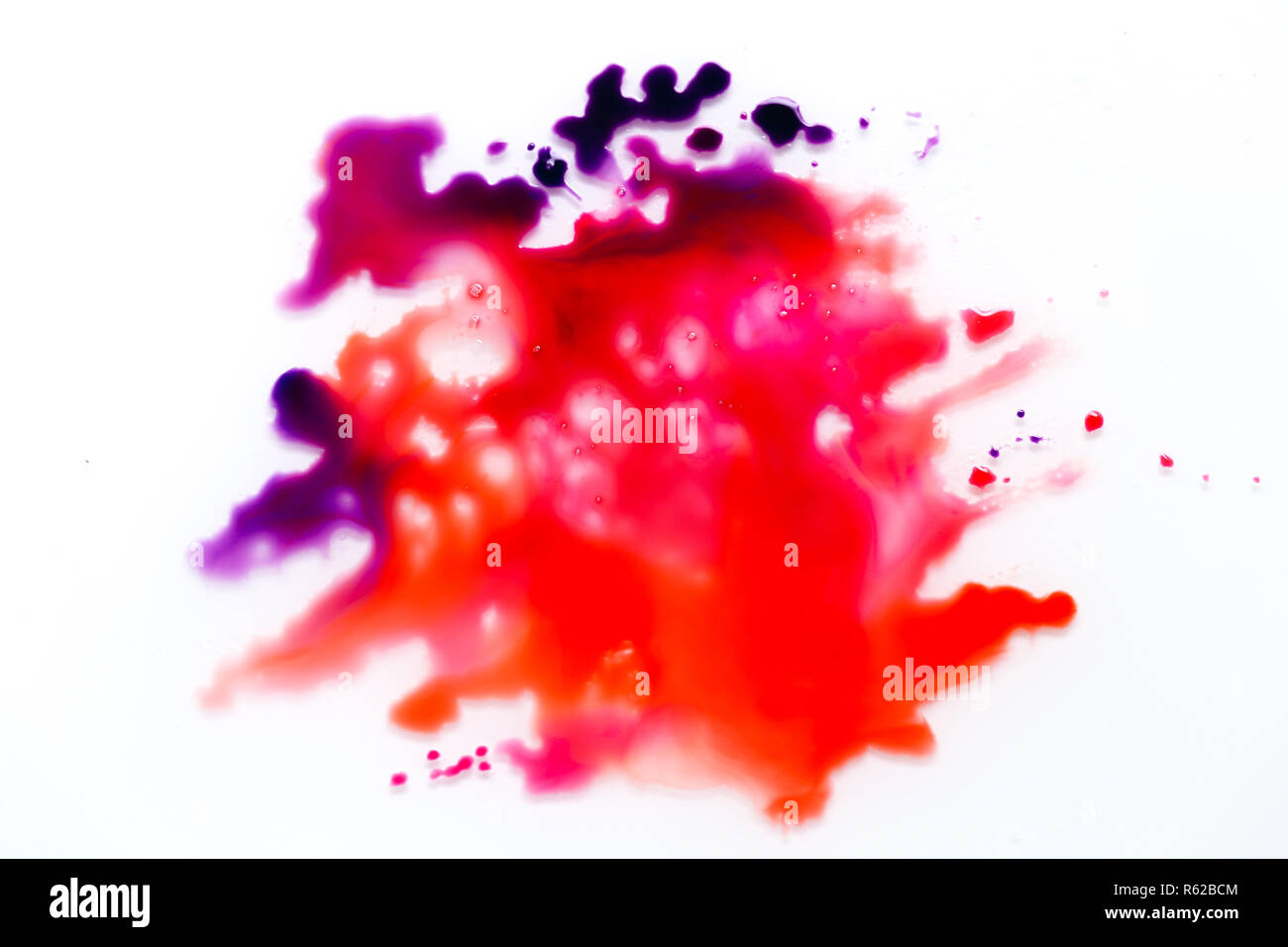 a spot of red paint on a white background. stain and spray Stock Photo ...