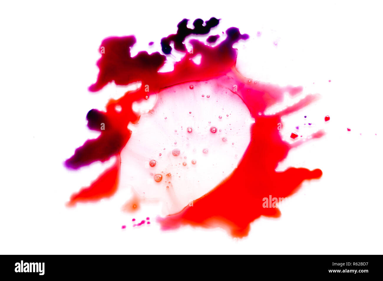 a spot of red paint on a white background. stain and spray Stock Photo ...
