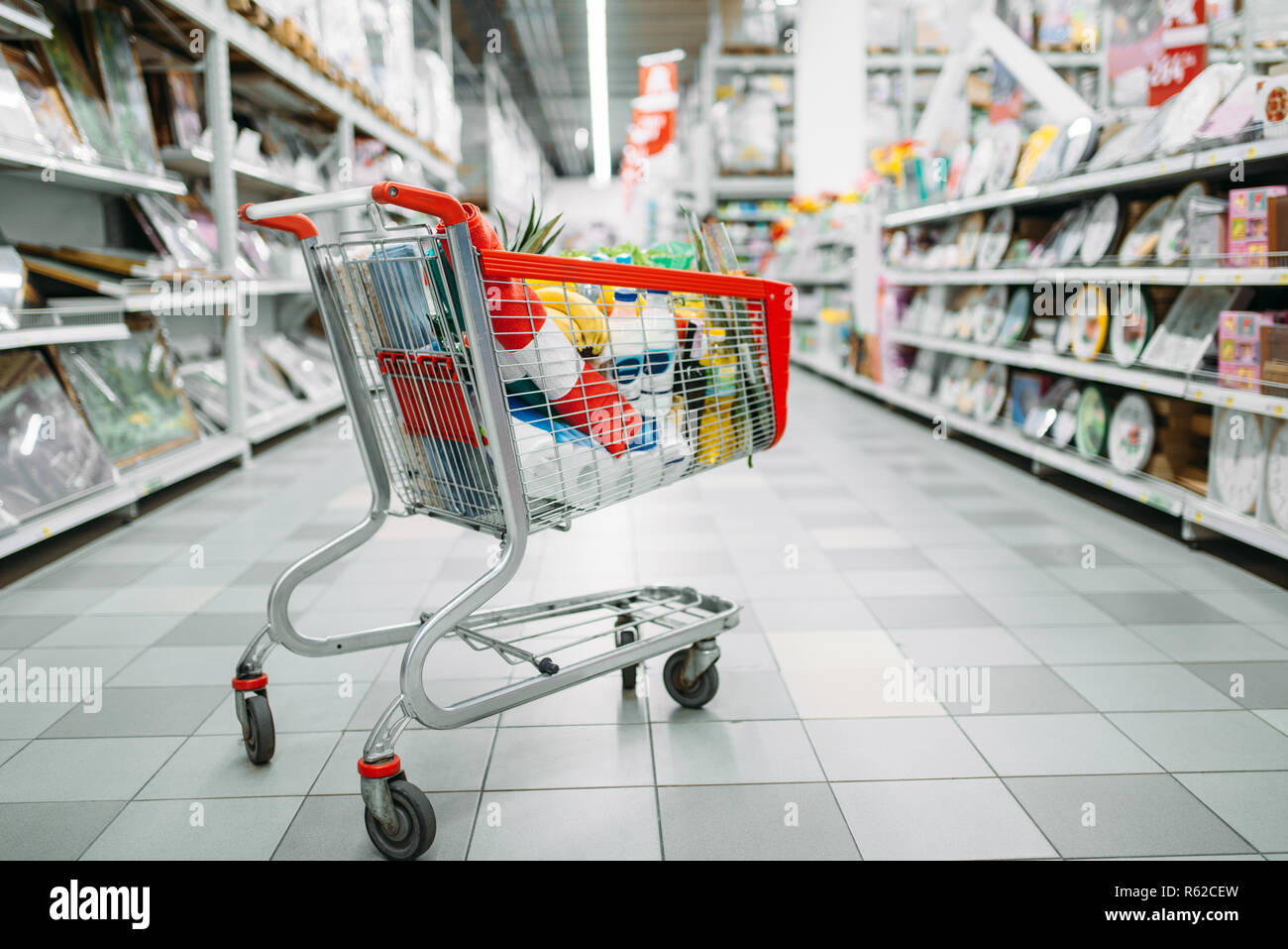 Cart full of goods in supermarket, nobody, shopping concept. Trolley ...