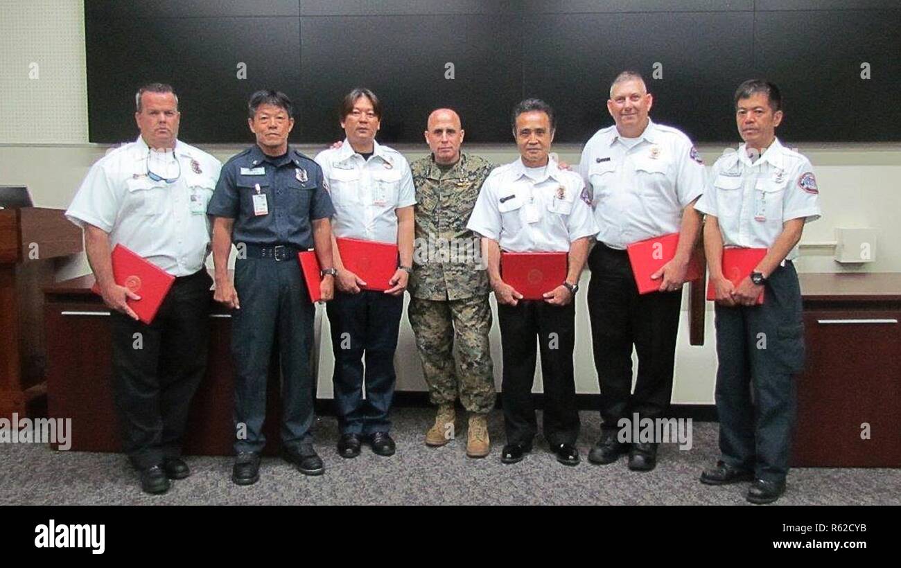 CAMP FOSTER, OKINAWA, Japan –Firefighters pose for a picture with Maj ...