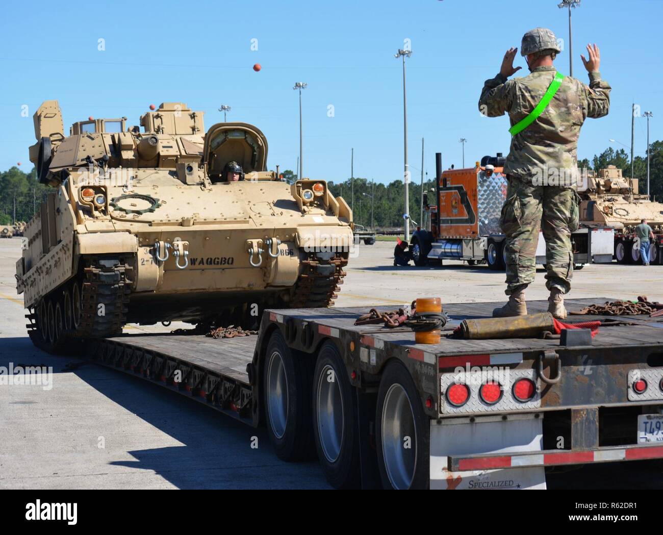 Soldiers from Company B, 2nd Battalion, 7th Infantry Regiment load a ...
