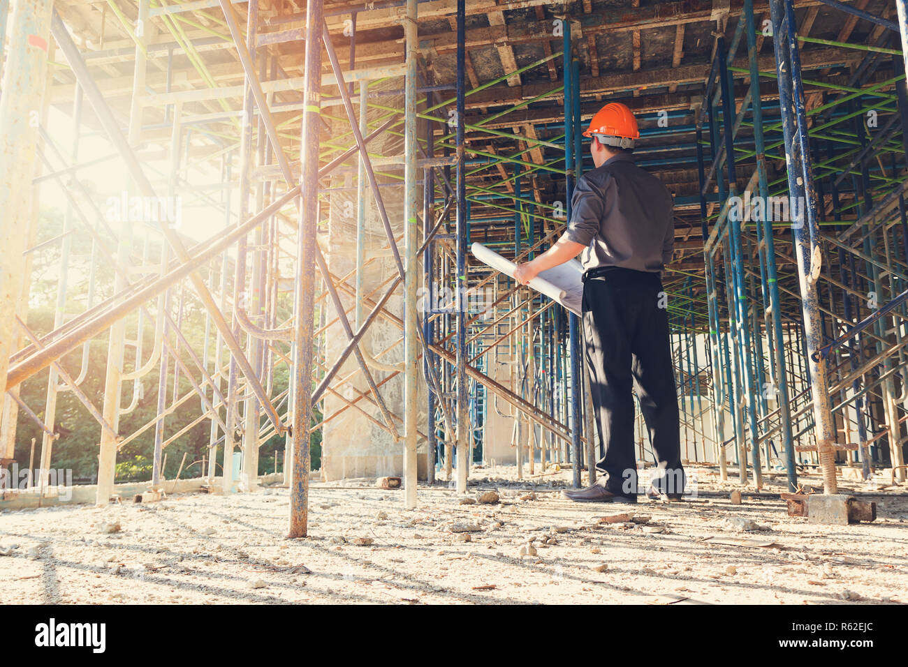 Construction concepts, Engineer and Architect working at Construction Site with blueprint Stock ...