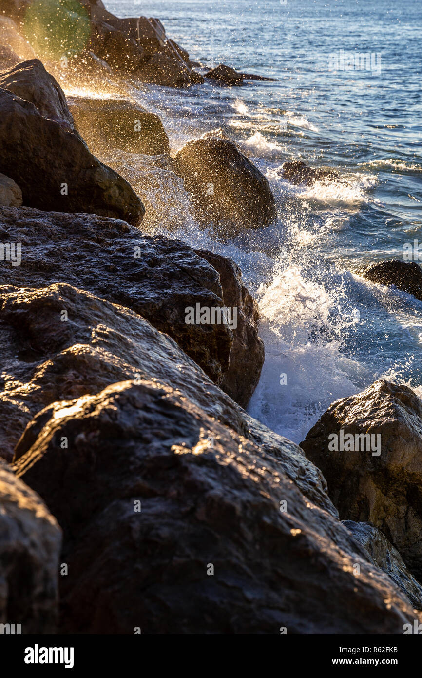 Moving wave and water of mediterranean sea touching rock beach making ...