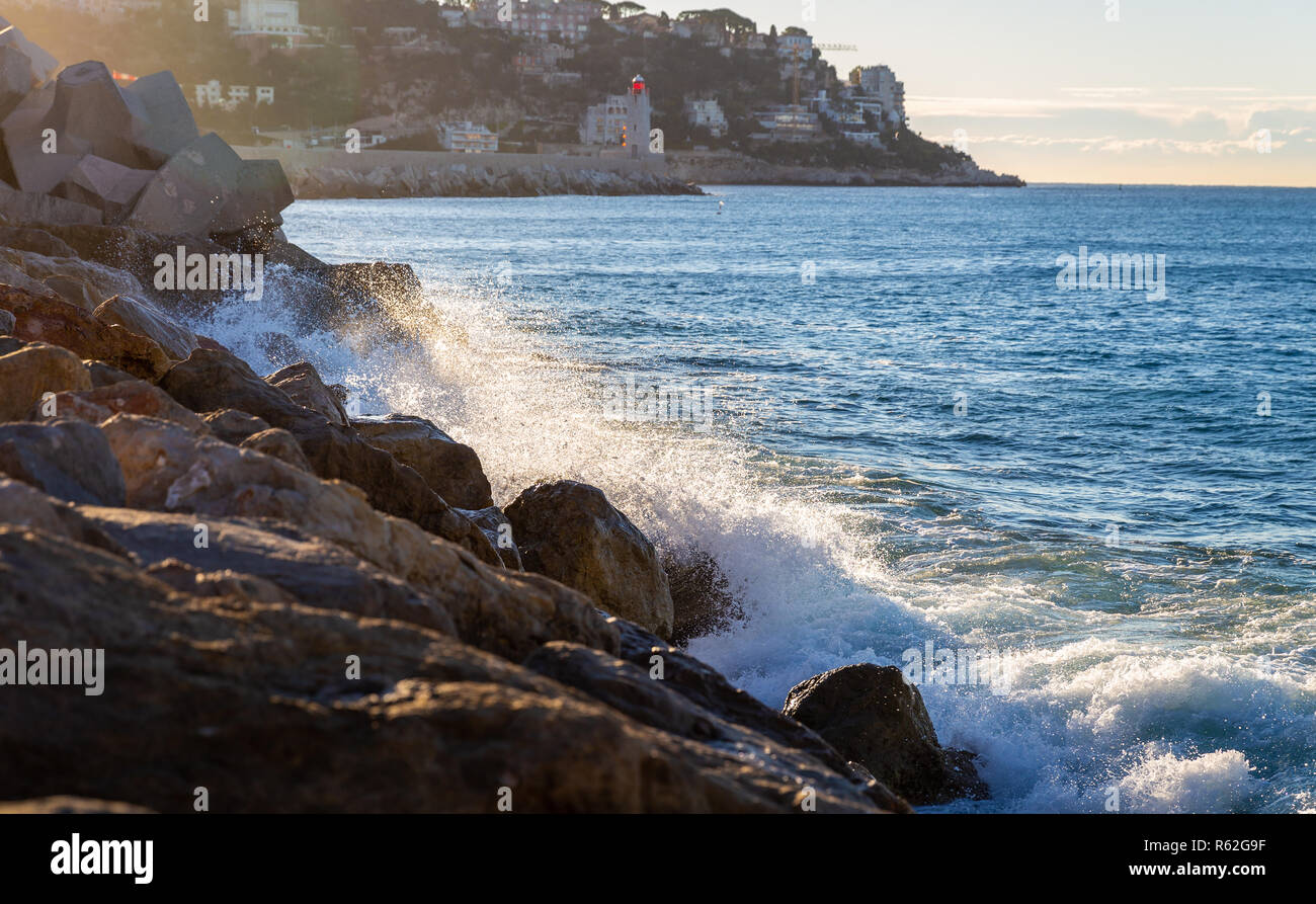 Moving wave and water of mediterranean sea touching rock beach making ...