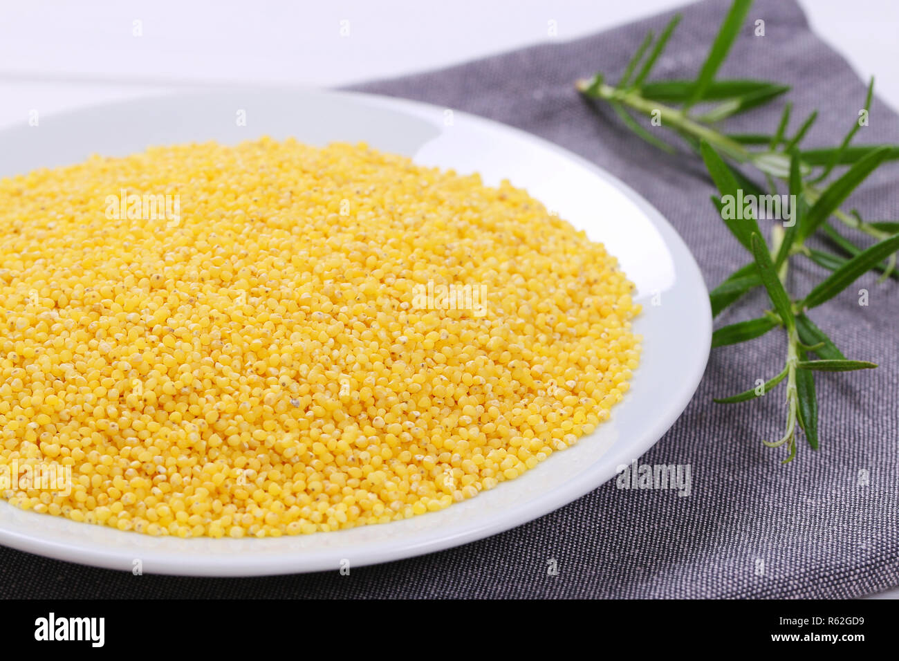 plate of raw millet grains Stock Photo - Alamy
