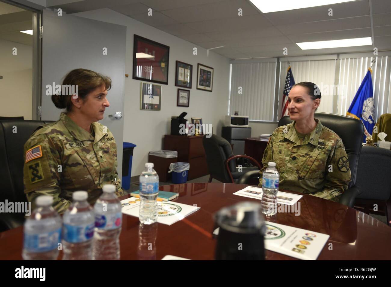 Brig. Gen. Kris A. Belanger, left, commanding general of the 85th ...