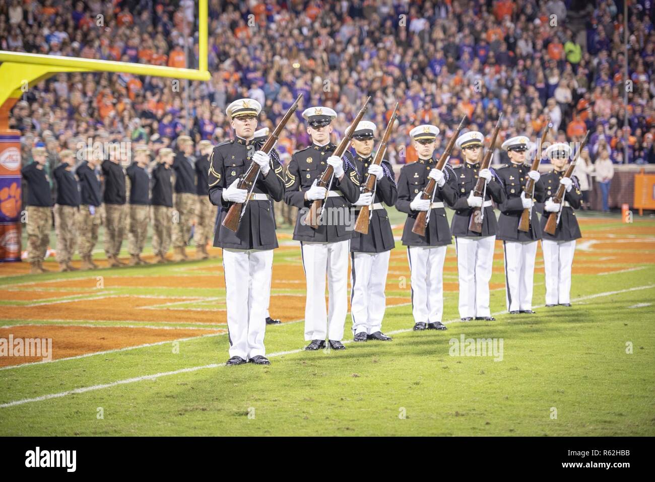The Clemson University Army ROTC honor guard the Pershing Rifles stand ...