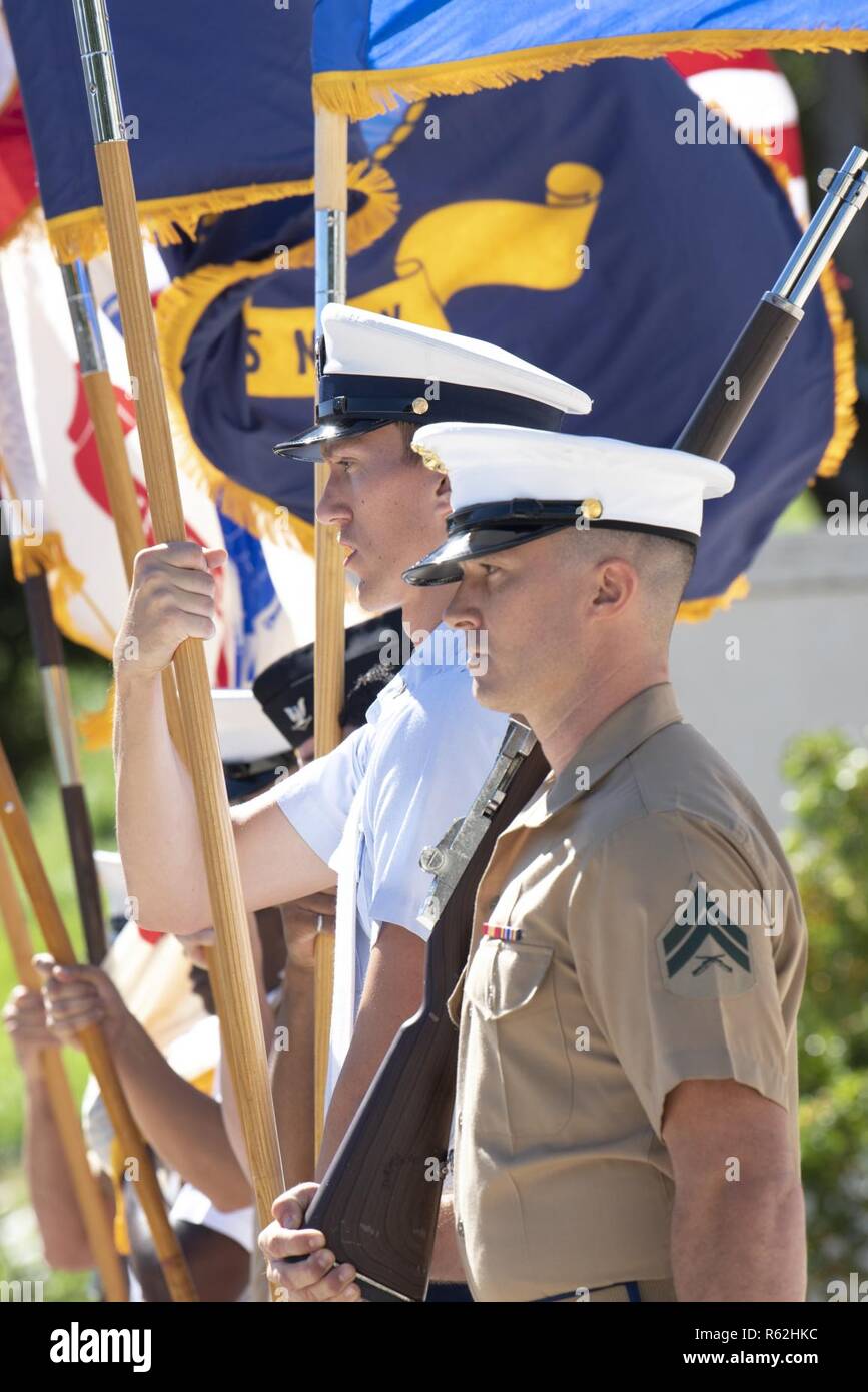 A joint service color guard parades the colors during a ceremony at the ...