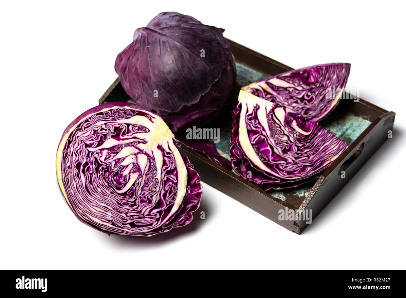 Purple cabbage slices on white table isolated Stock Photo - Alamy