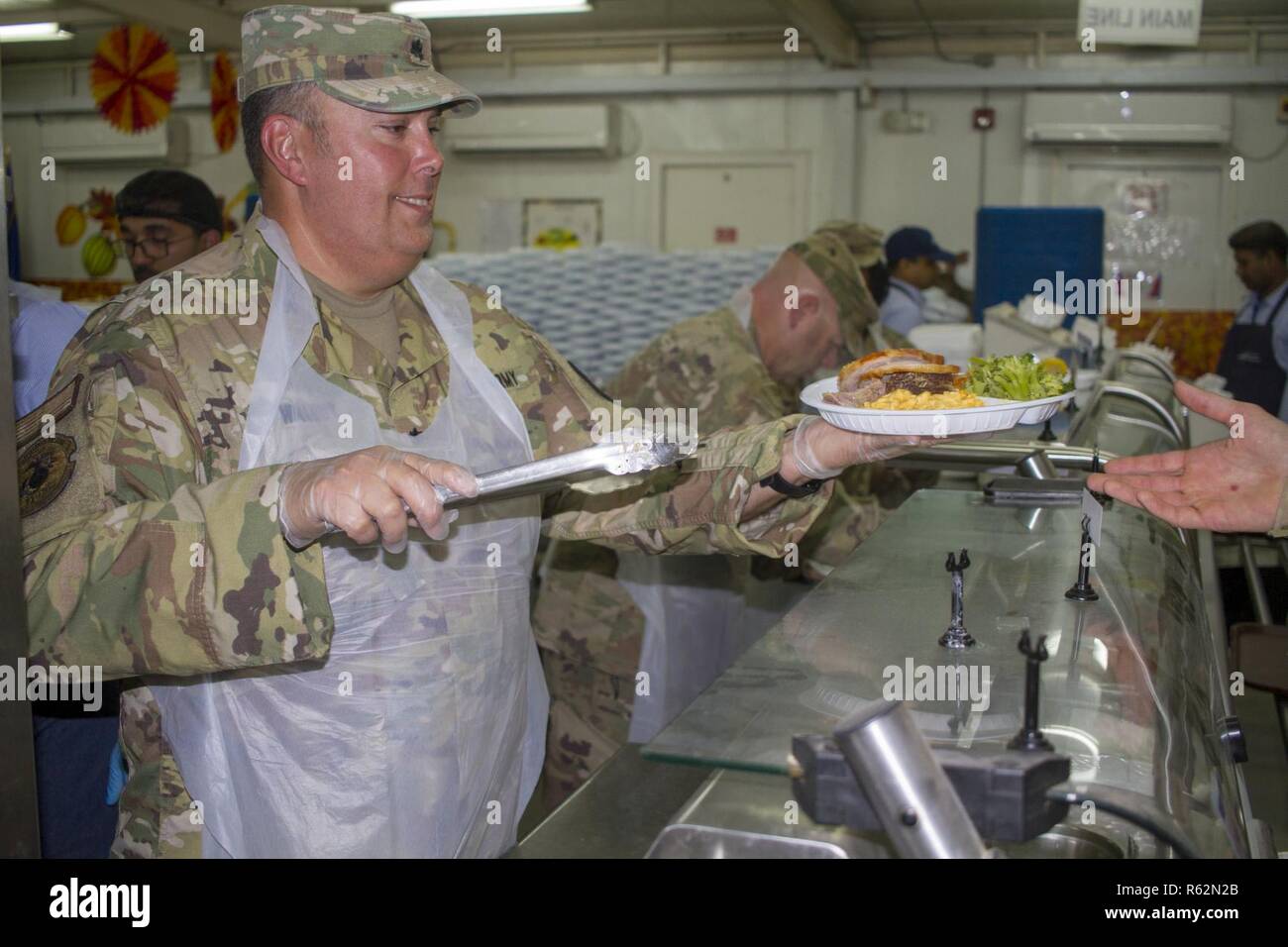 Members of the 155th Armored Brigade Combat Team staff serve ...