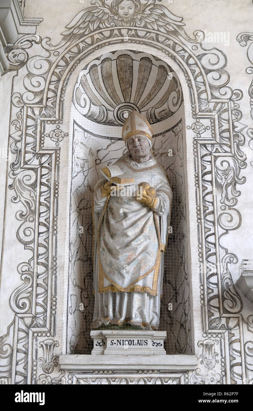 Saint Nicholas statue on the facade of the church of St. Leodegar in ...