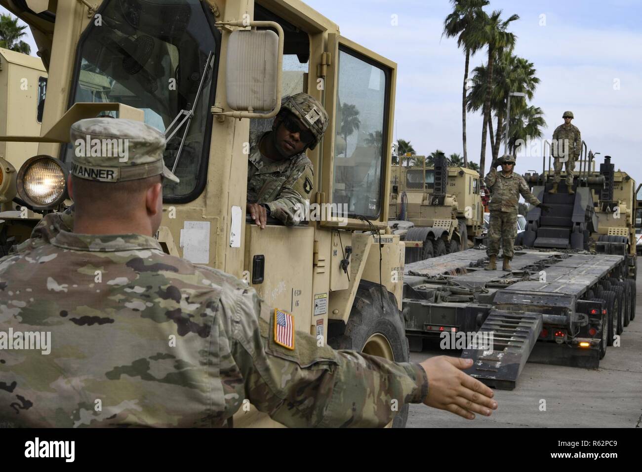 U.S. Army Soldiers with the 96th Transportation Company load a forklift ...