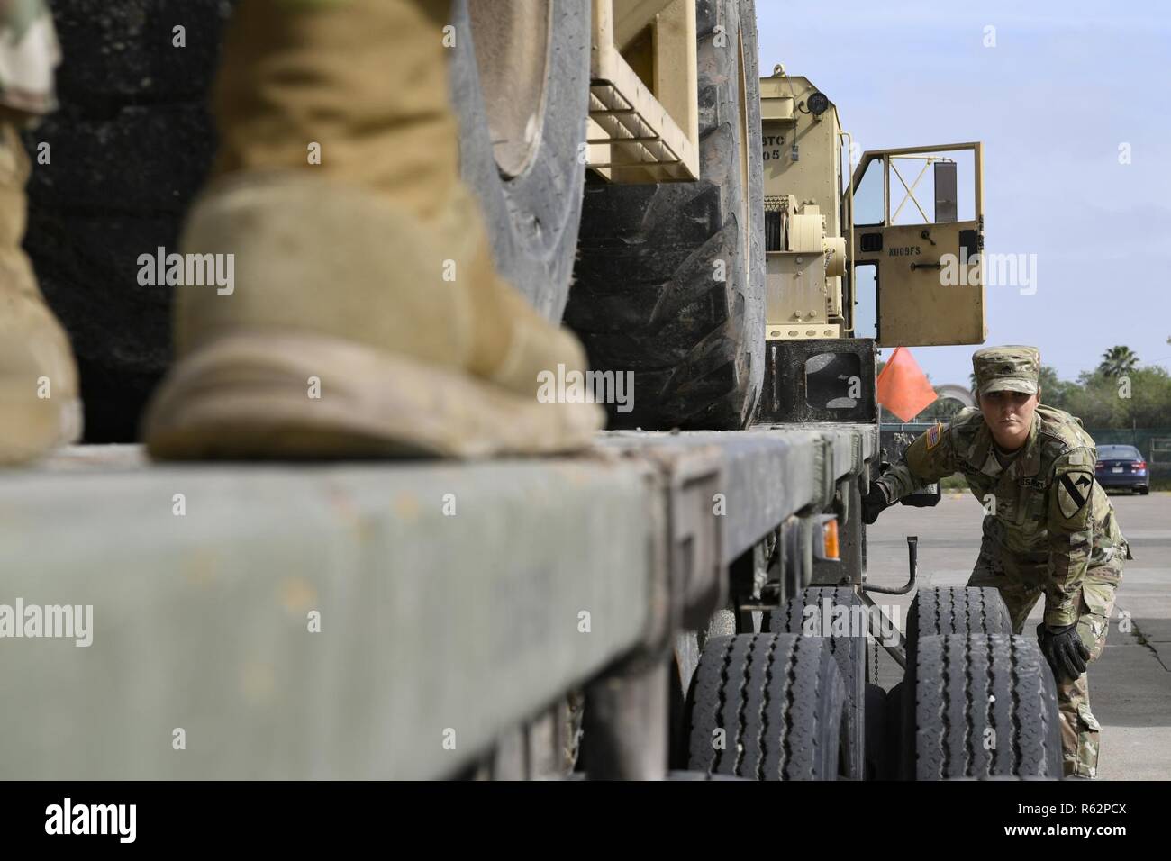 A U.S. Army Soldier with the 96th Transportation Company loads a ...