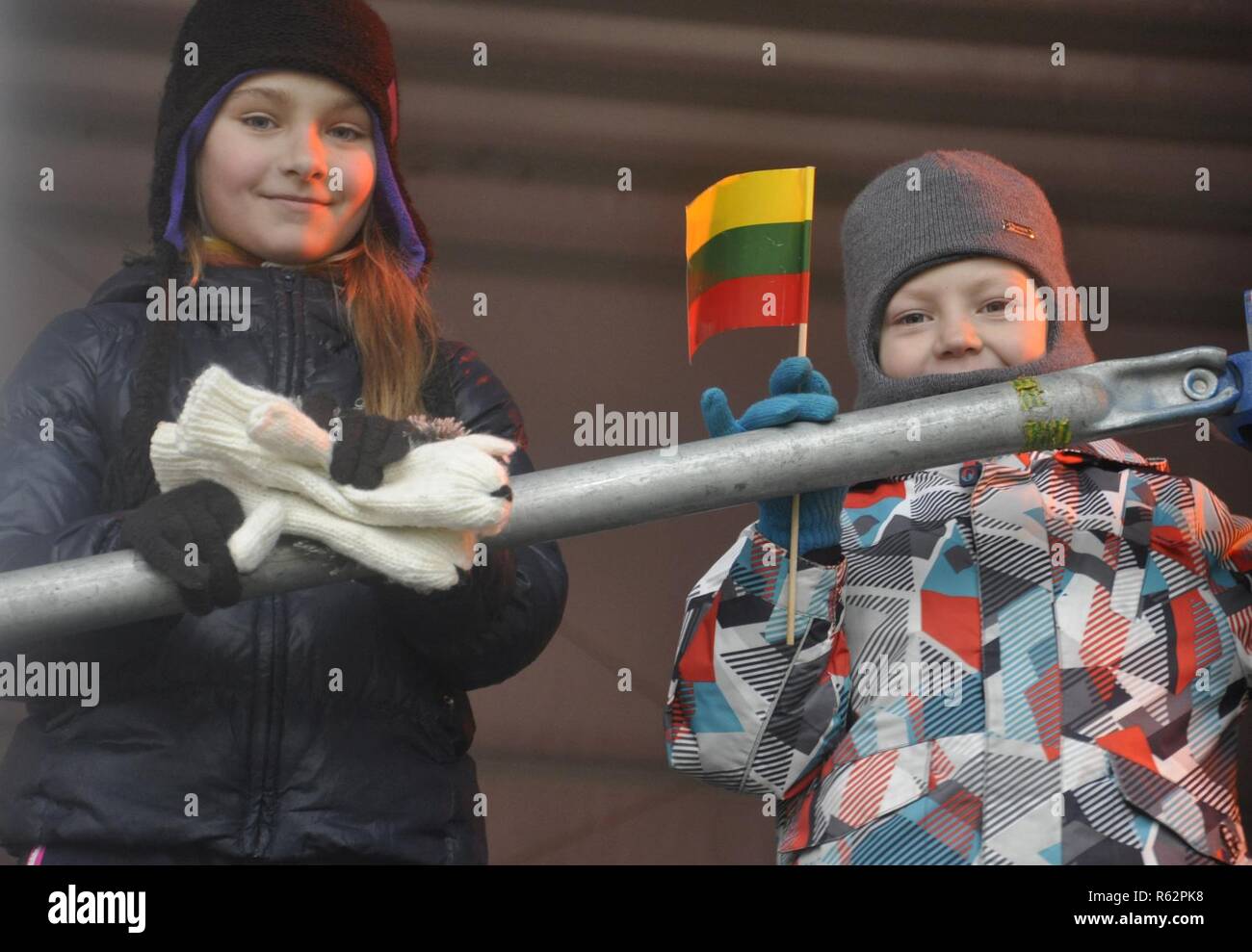 Children wave the Lithuanian flag during the 100-year anniversary ...
