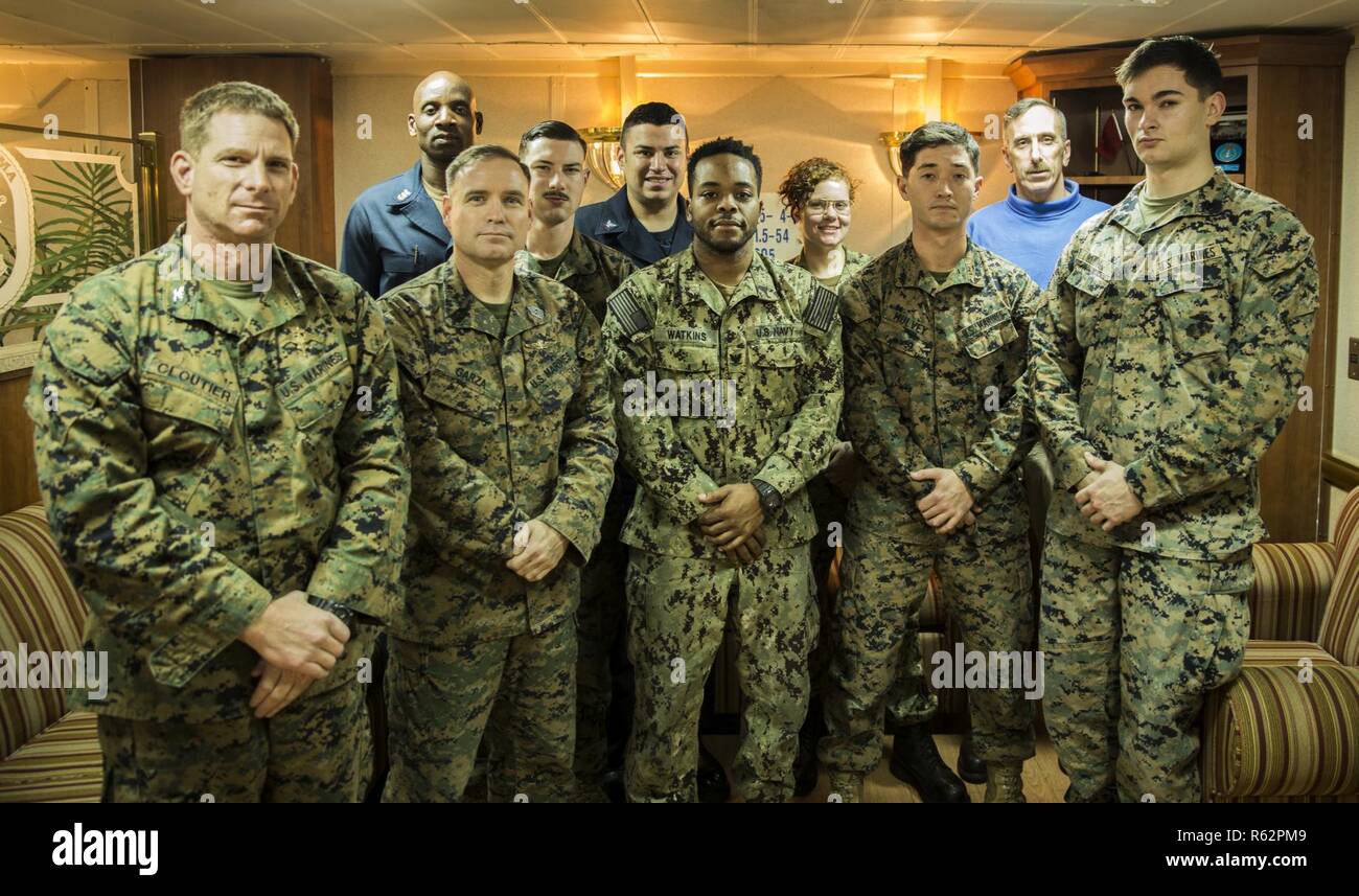 Marines and Sailors awarded with the Hard Charger of the Day award pose ...