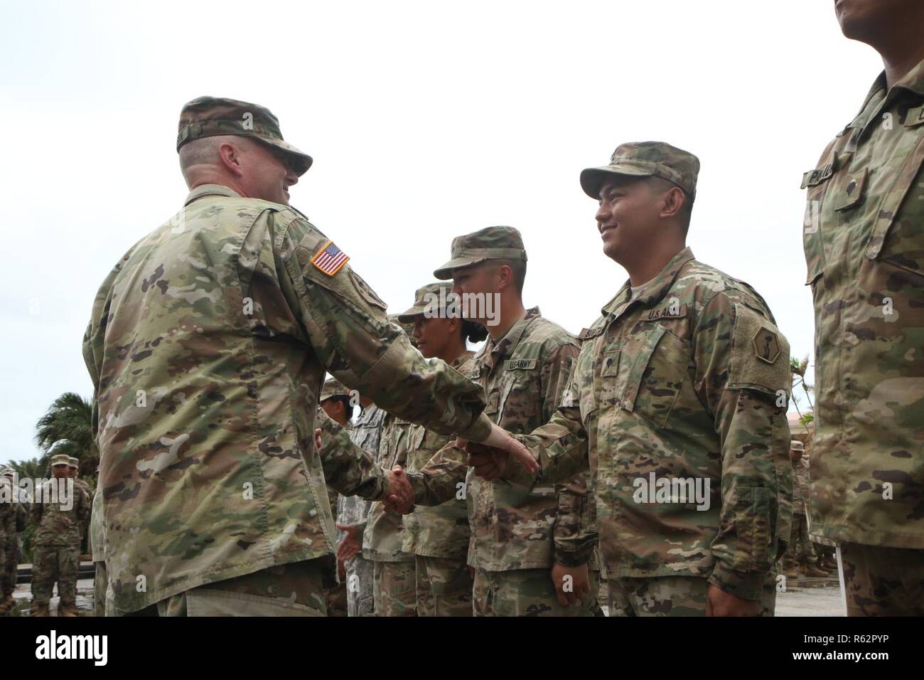 U.S. Army Spc. Jonathan Sugutan, right, a Soldier with the 9th Mission ...