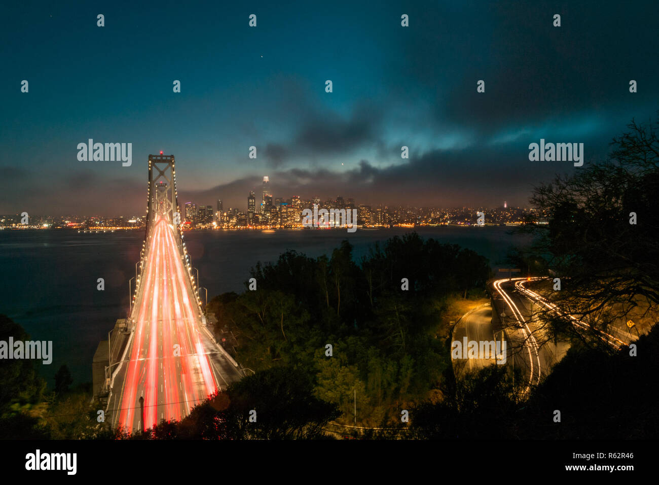 Bay bridge in the San Francisco Bay Area by night with long exposure ...