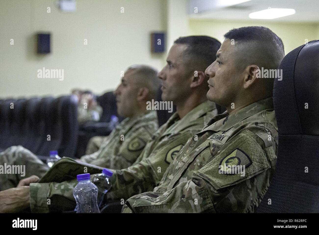 The warrant officers of the 300th Sustainment Brigade listens to ...