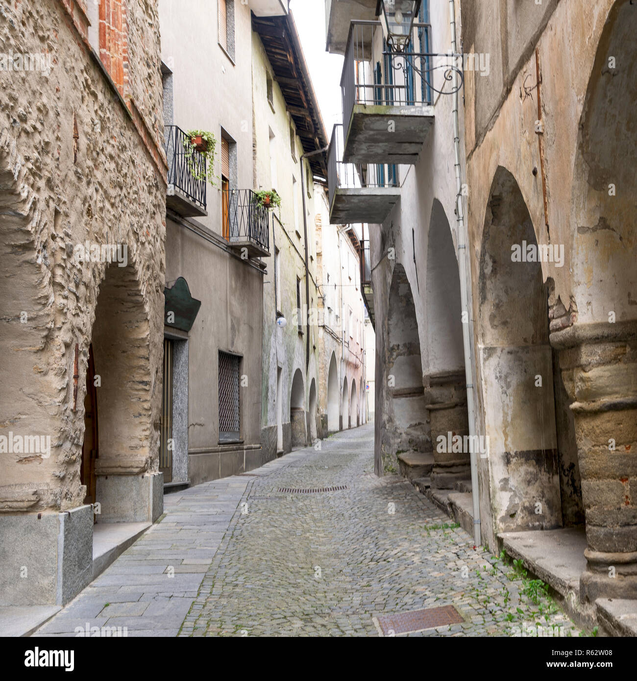 Barge, Cuneo, Piedmont, Italy: historic buildings along an old typical ...