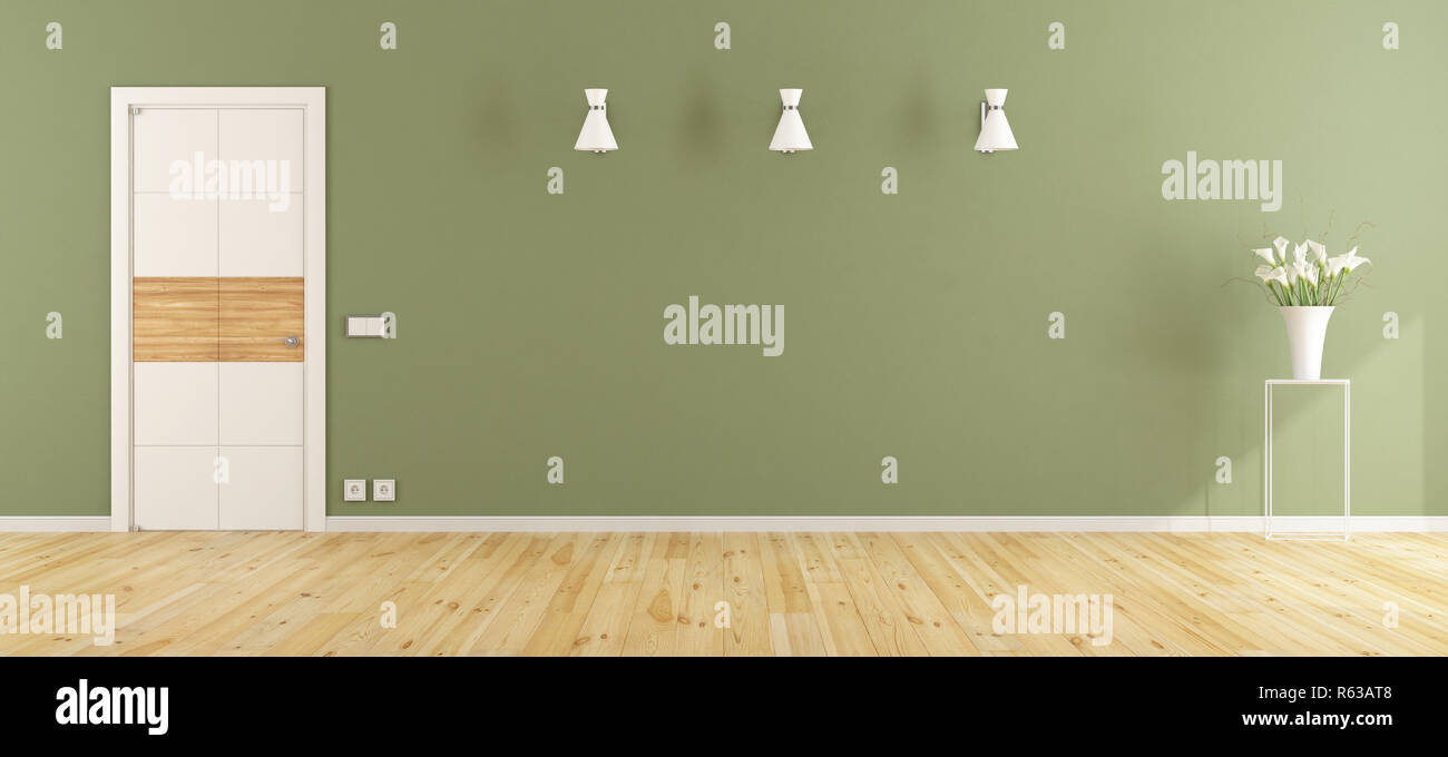 Empty green room with closed door Stock Photo - Alamy