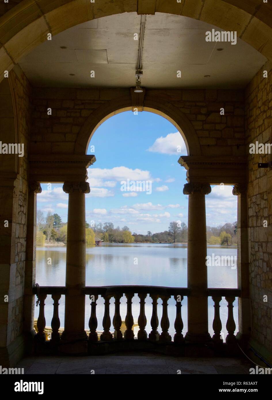 A view of a lake through the columns of a folly temple Stock Photo - Alamy
