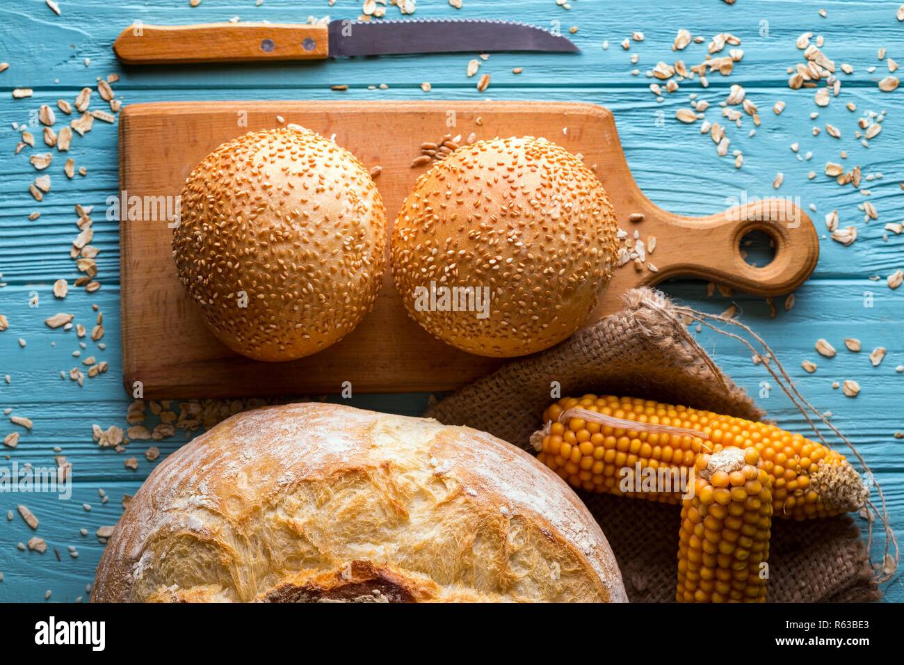 different fresh bread and buns on a blue background Stock Photo - Alamy