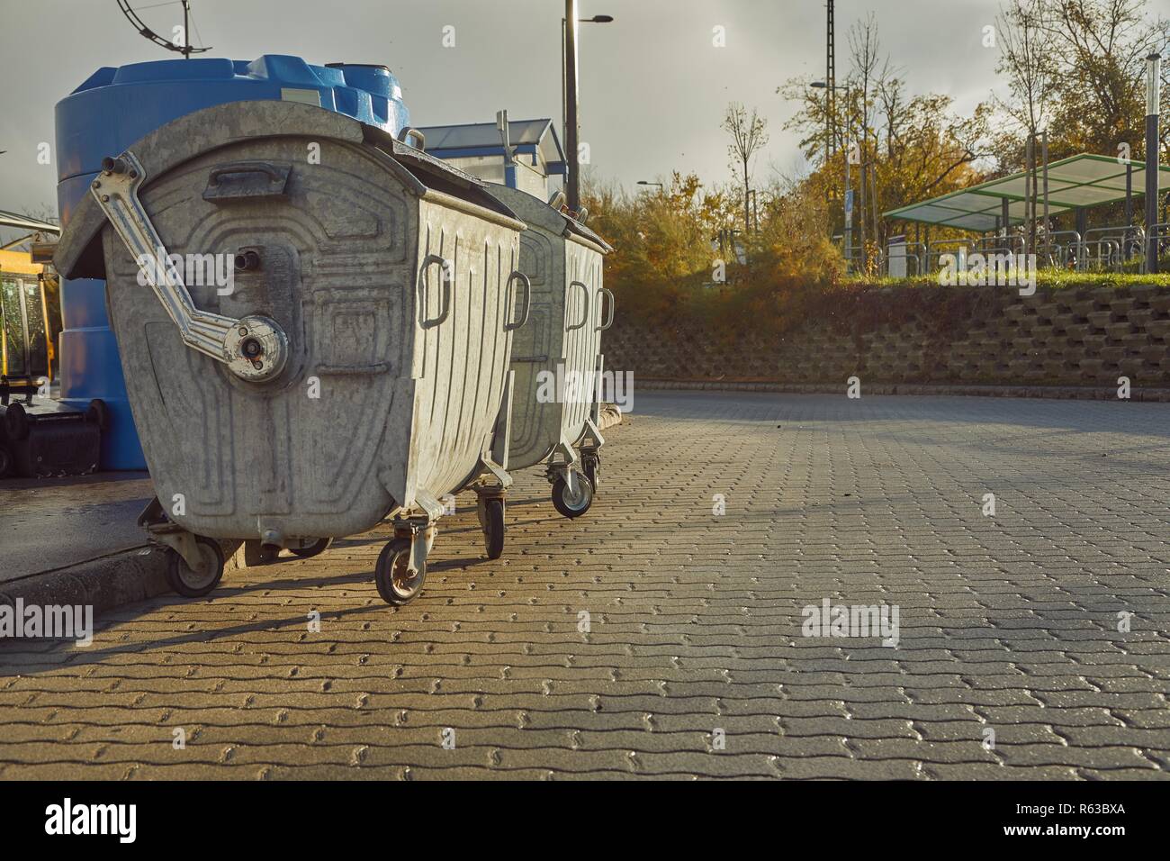 Garbage Containers in a urban area Stock Photo - Alamy