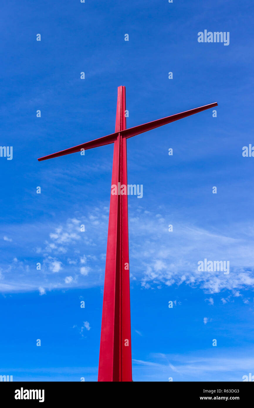 Red cross against blue sky background Stock Photo - Alamy