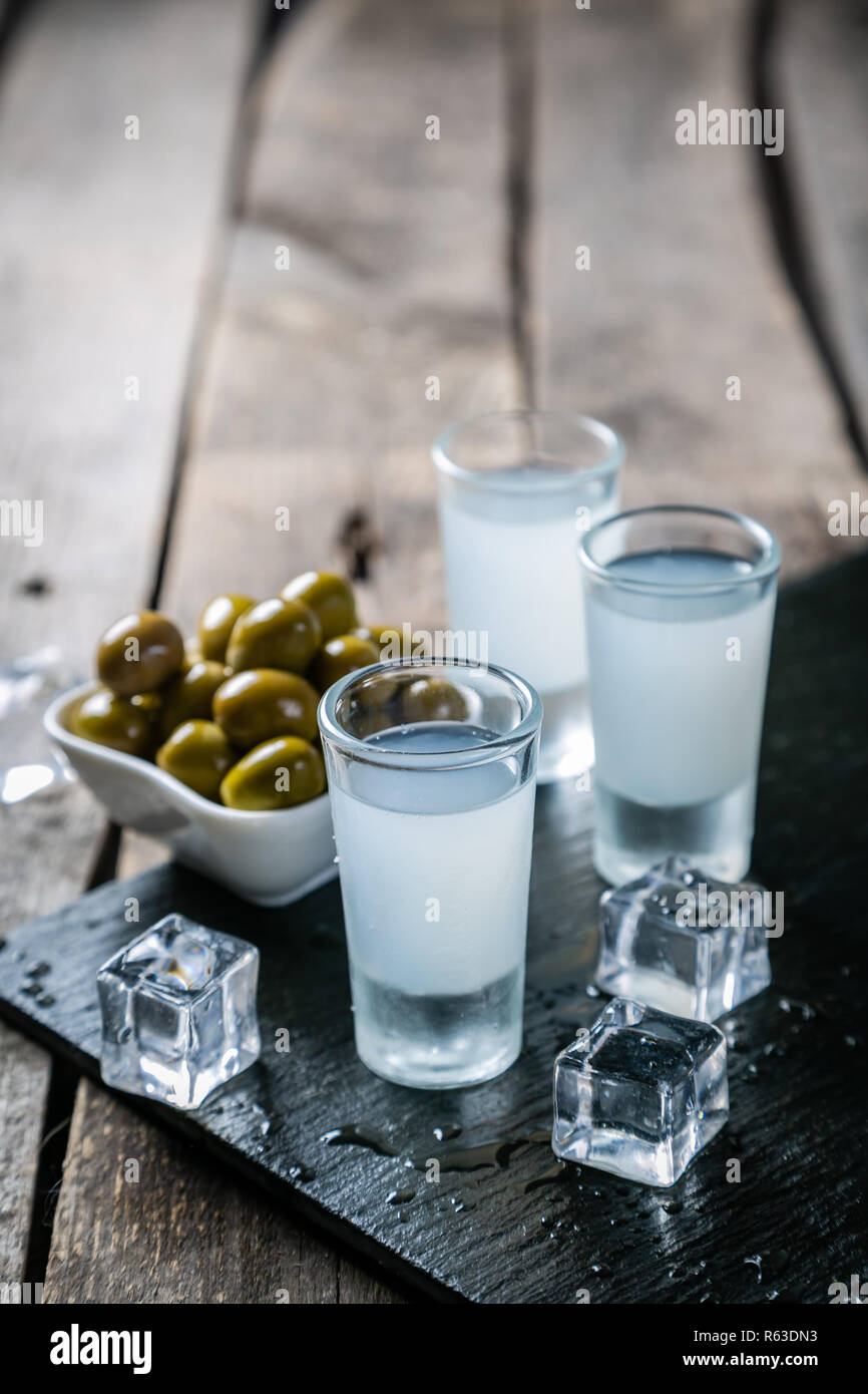 Traditional greek vodka - ouzo in shot glasses Stock Photo - Alamy