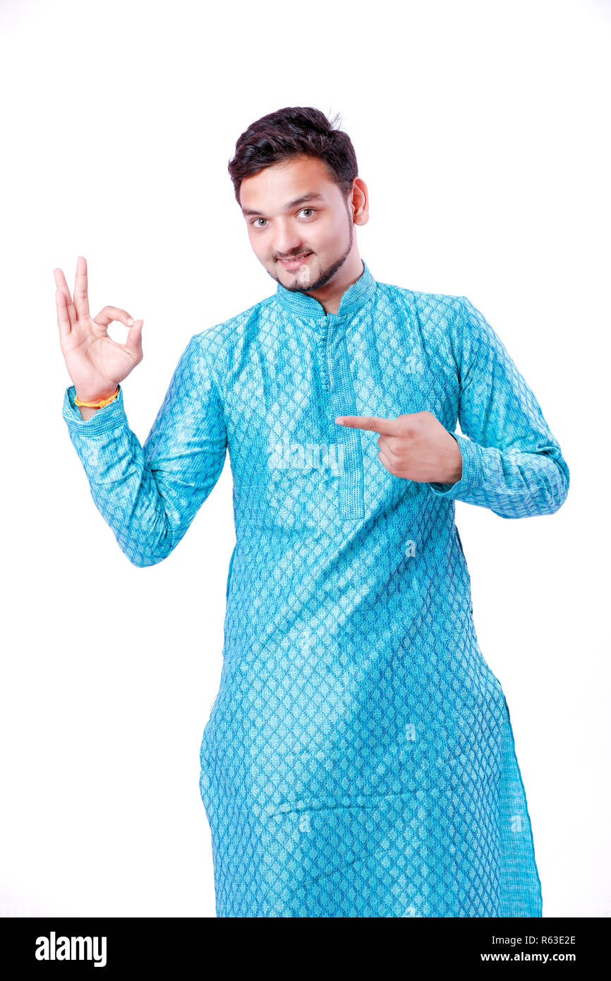 Indian man in ethnic wear , showing gesture with hand , isolated over ...
