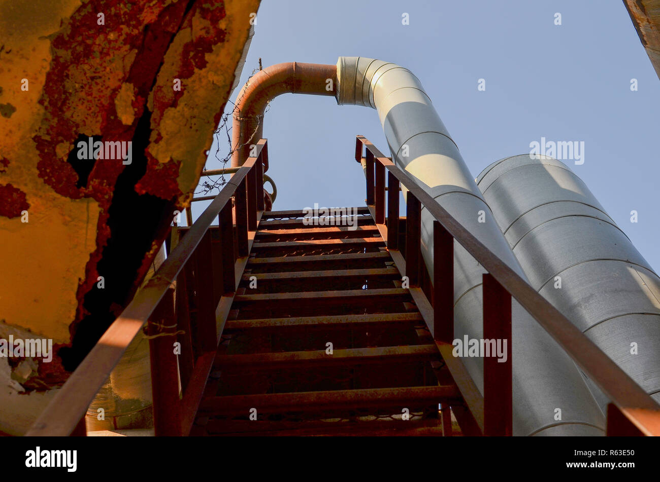 Metal ladder in the industrial area, for maintenance of pipes Stock ...