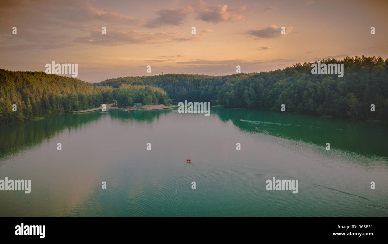 Drone view of forest and lake during summer sunset Stock Photo - Alamy