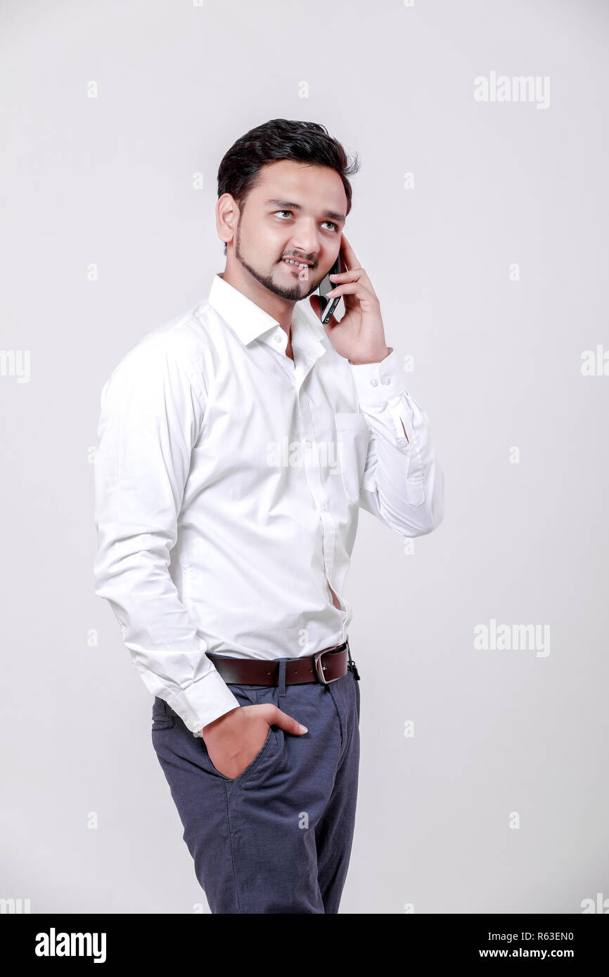 Young indian man using mobile Stock Photo - Alamy