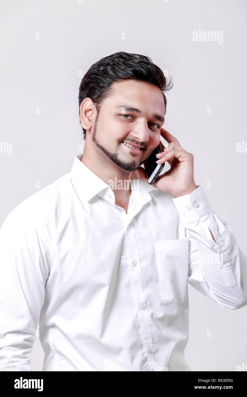 Young indian man using mobile Stock Photo - Alamy