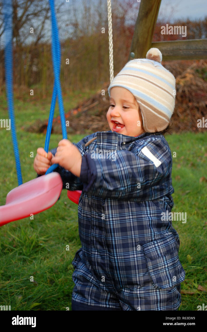 toddler with swing Stock Photo - Alamy