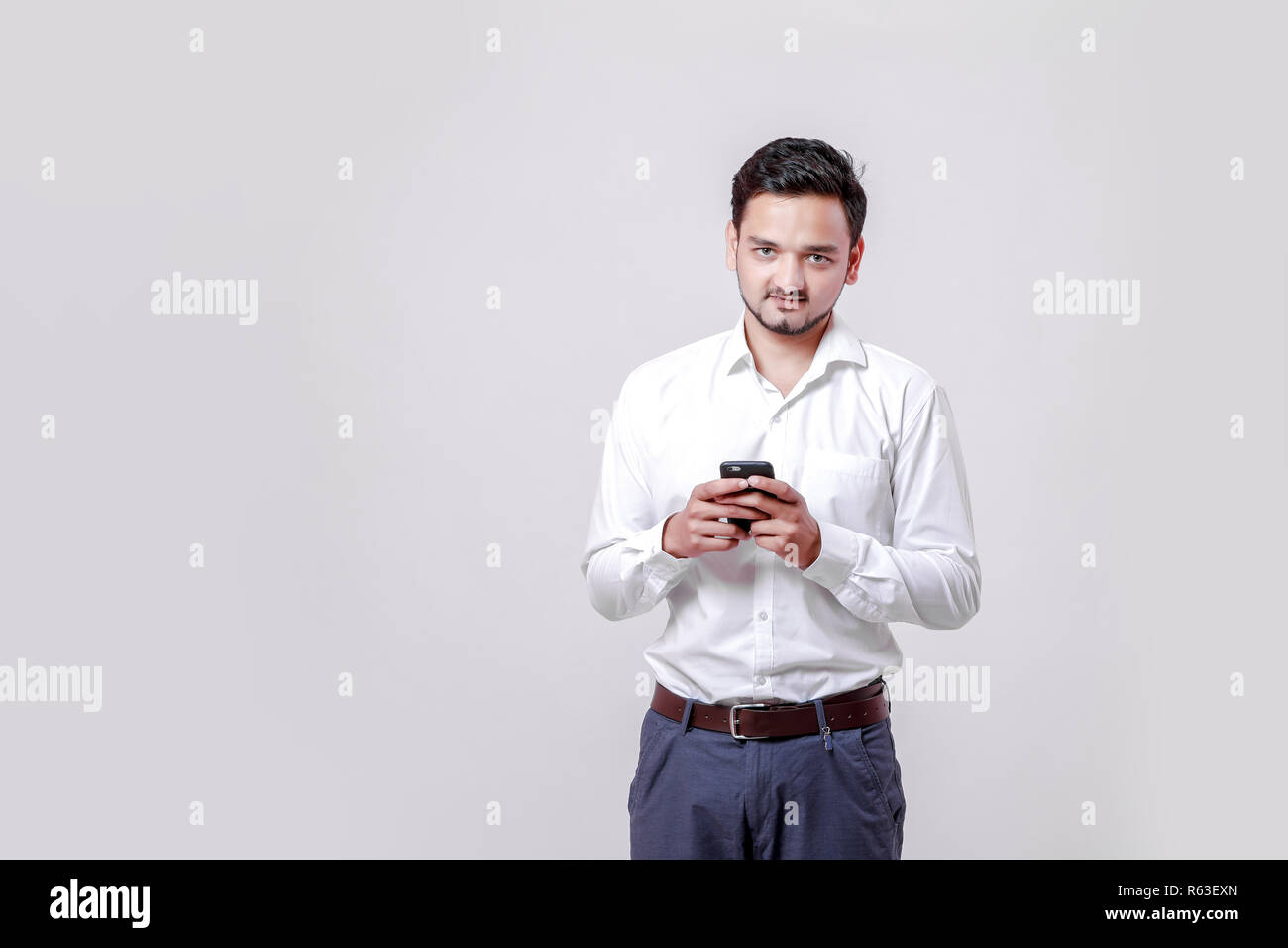 Indian businessman using mobile hi-res stock photography and images - Alamy