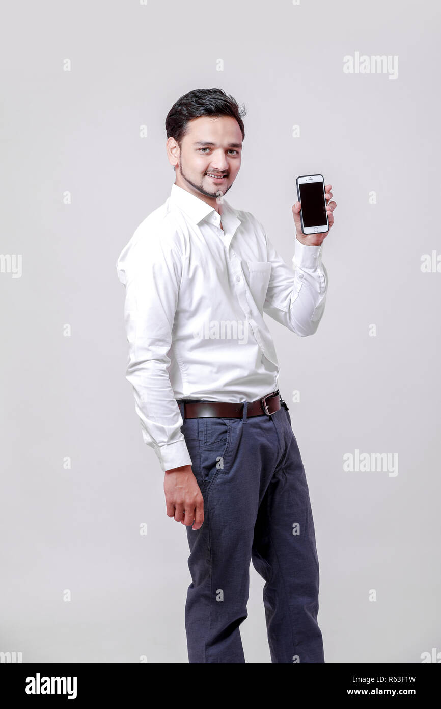 Young indian man using mobile Stock Photo - Alamy