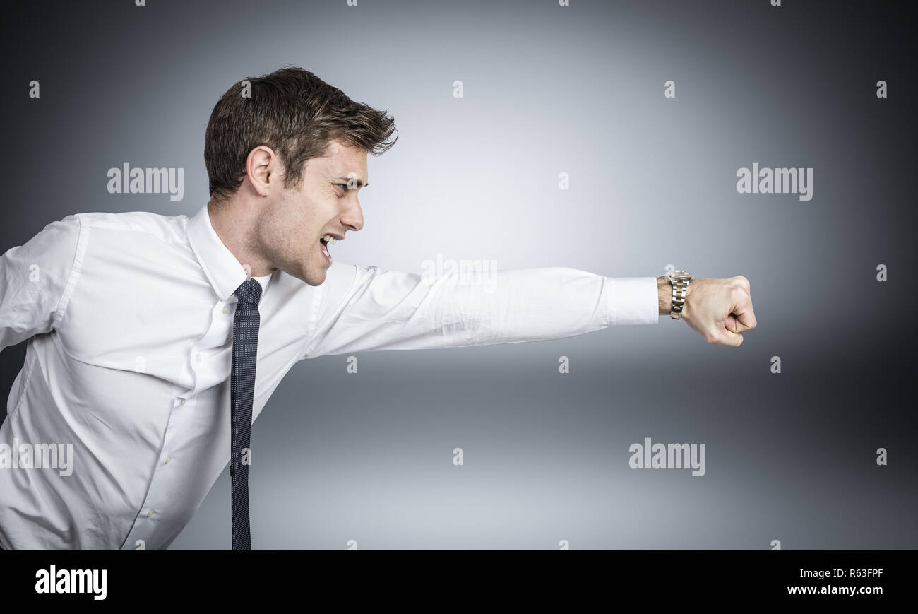 portrait of angry businessman in punch pose studio shot Stock Photo - Alamy