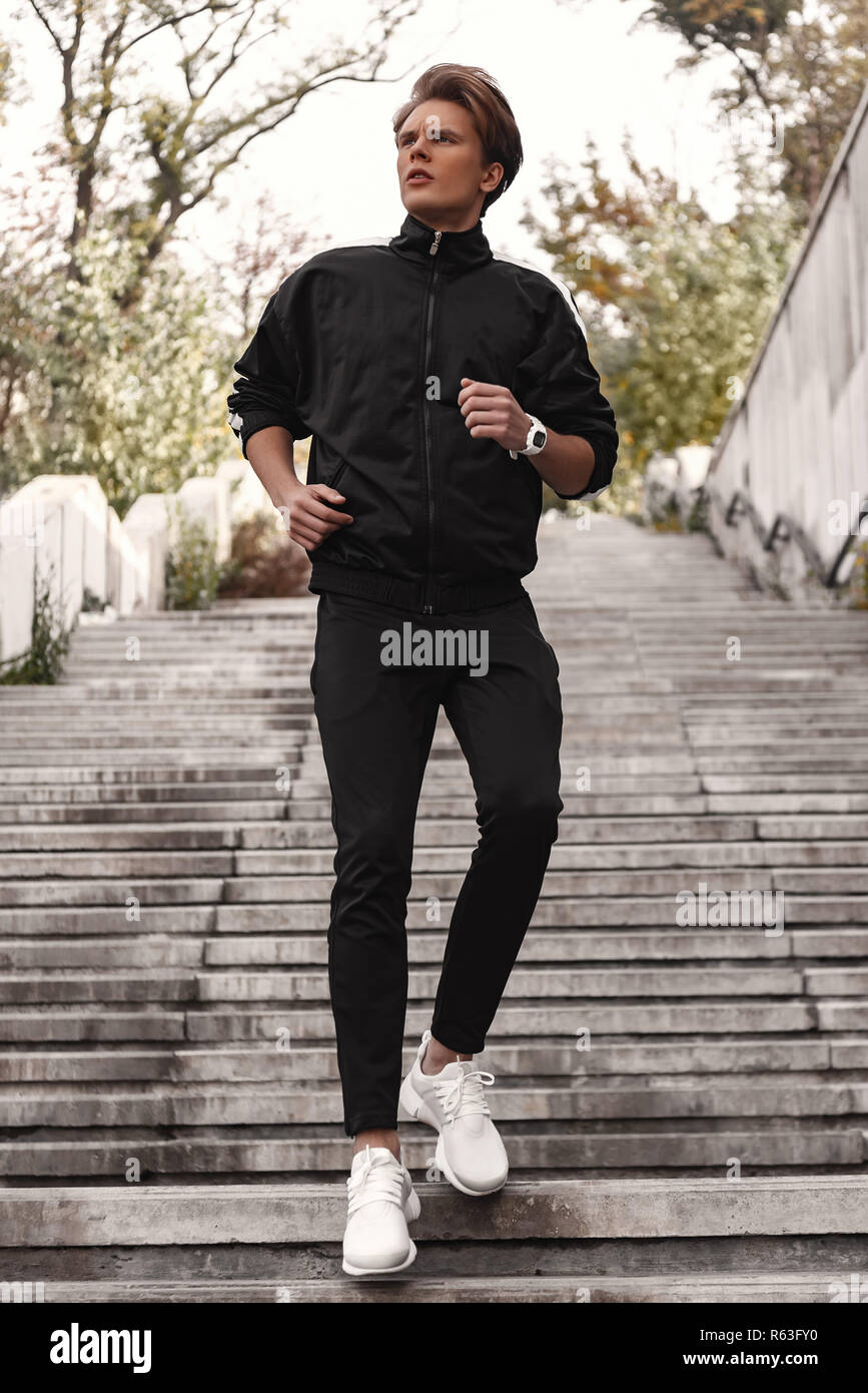 Man running downstairs hi-res stock photography and images - Alamy