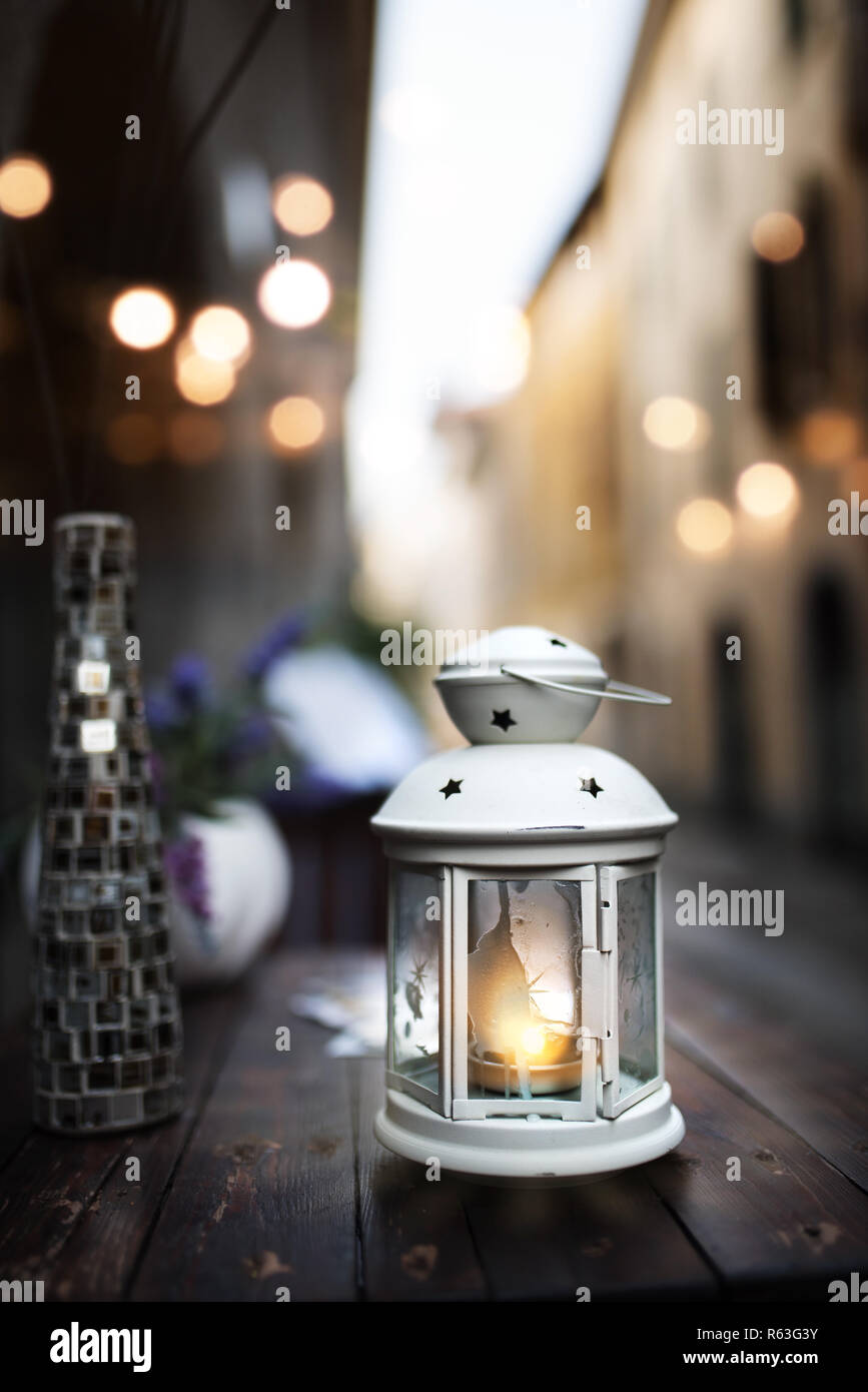 still life with burning lantern Stock Photo - Alamy