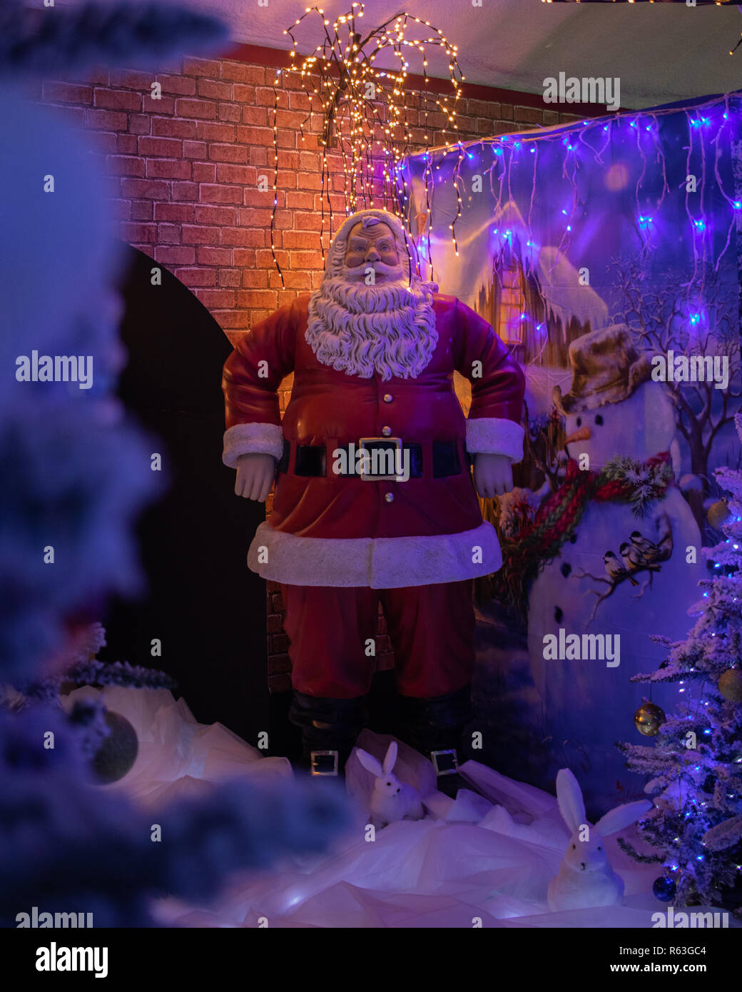 Christmas decoration scene with a father Christmas / Santa Claus statue ...