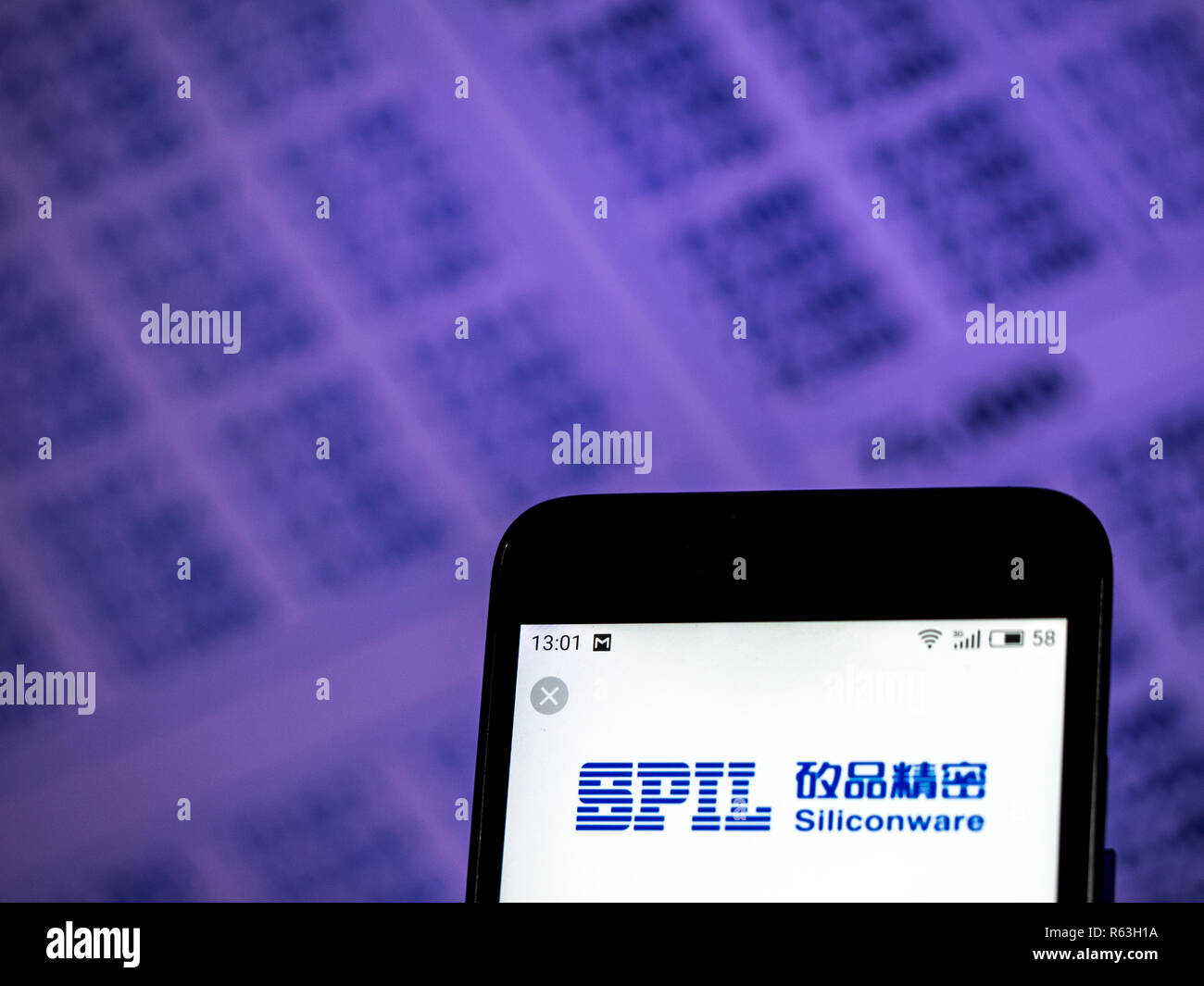 Siliconware Precision Industries logo seen displayed on smart phone ...