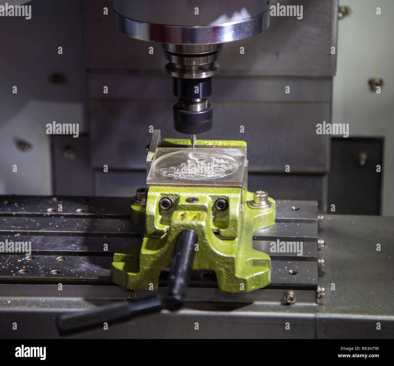 CNC milling machine engraving plastic workpiece, industrial machining ...