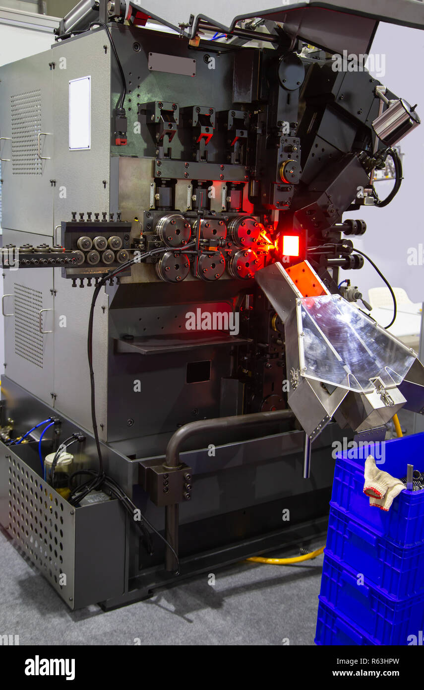 Production of making spring on CNC spring coiling machine Stock Photo ...