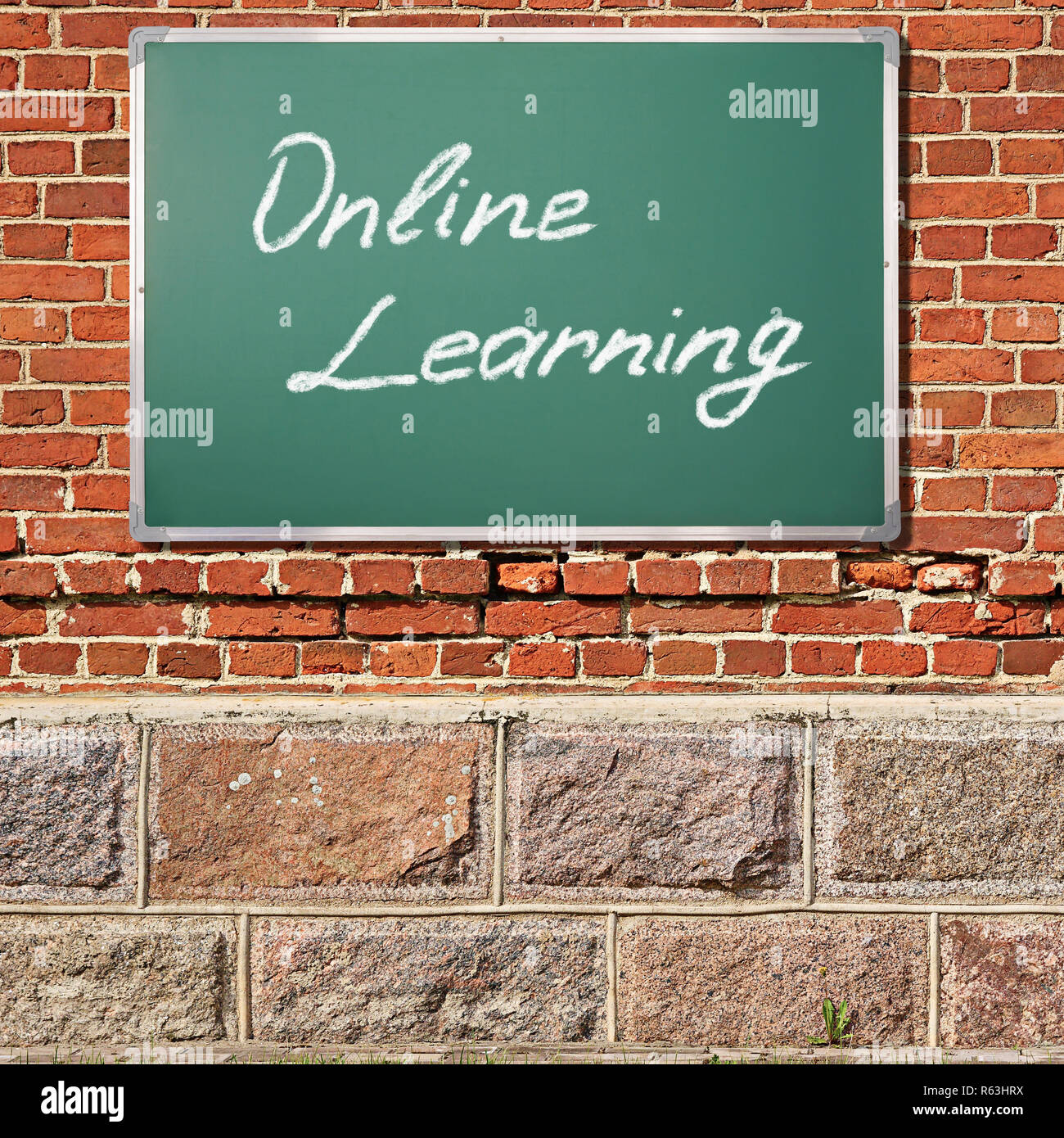 Education theme. Ancient brick wall with Online Learning title on a ...