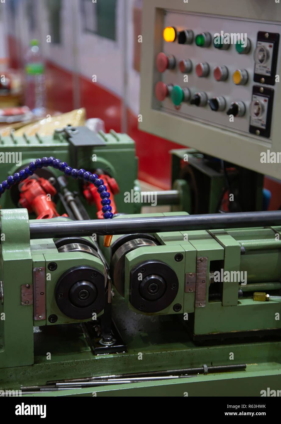 Hydraulic thread rolling machine making thread on spindle Stock Photo ...