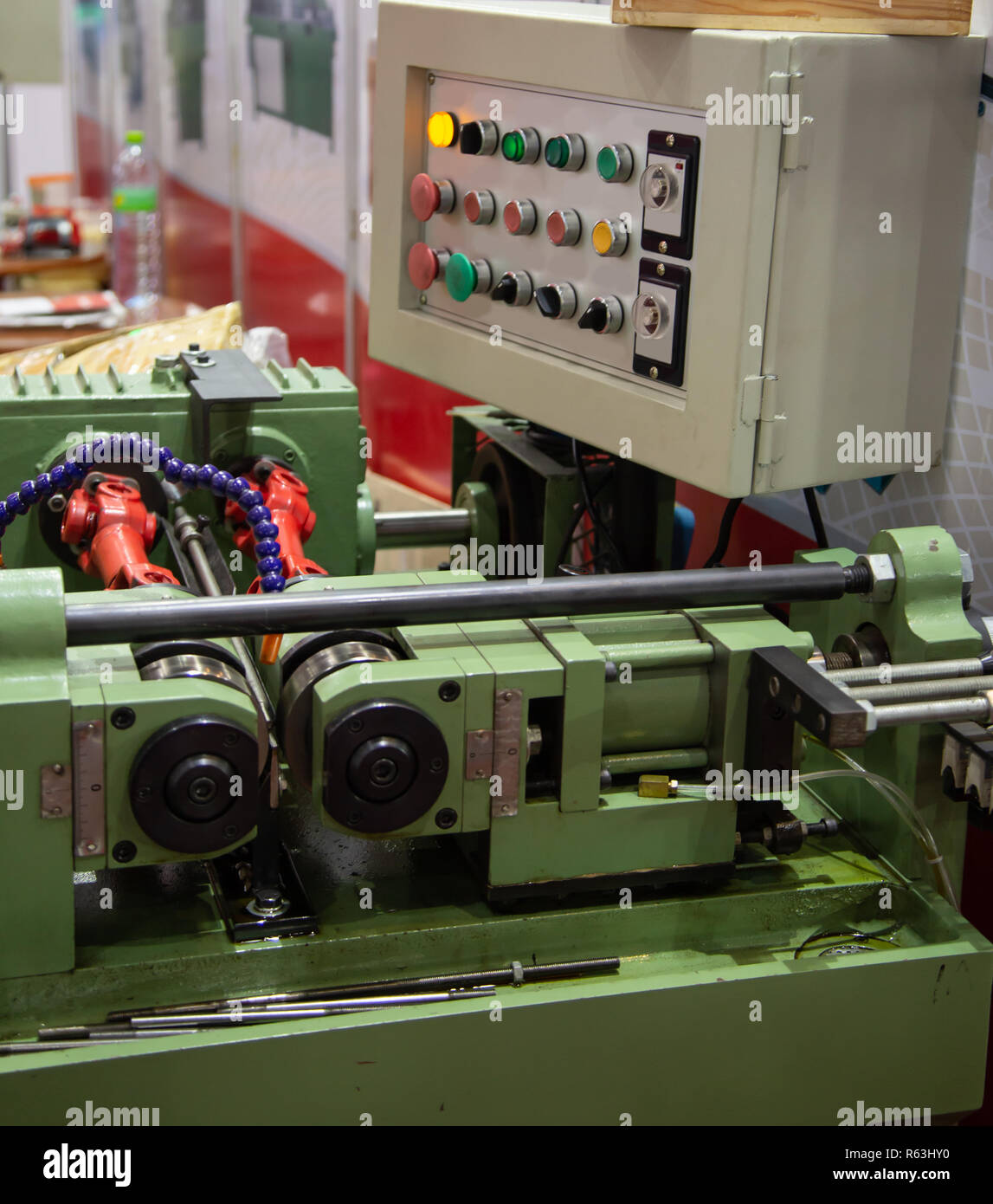 Hydraulic thread rolling machine making thread on spindle Stock Photo ...